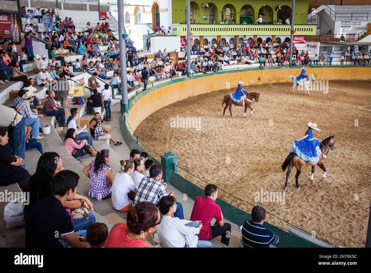 Escaramuzas ride their horses. A charreada Mexican rodeo at the Lienzo ...