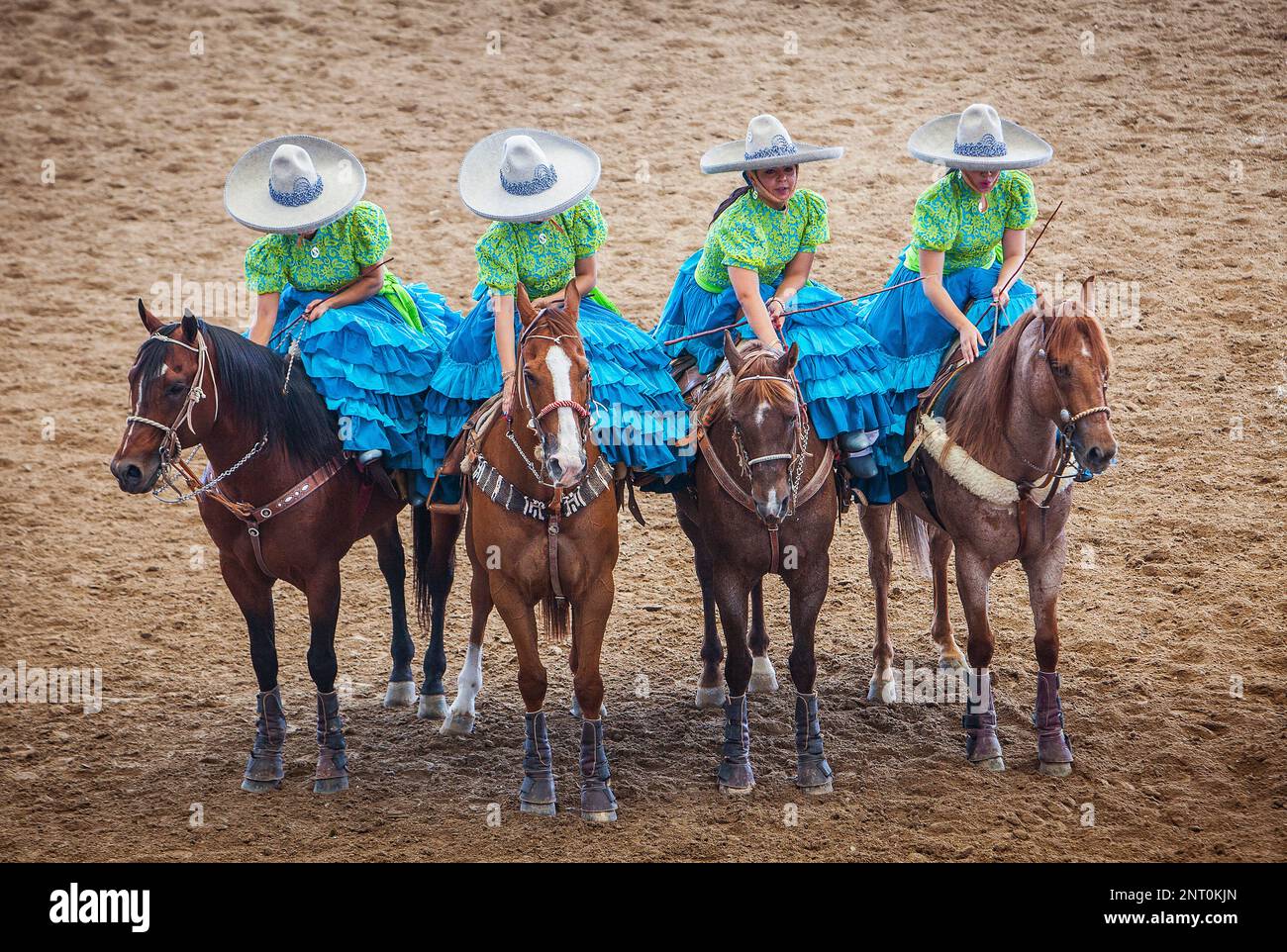Escaramuzas ride their horses. A charreada Mexican rodeo at the Lienzo ...