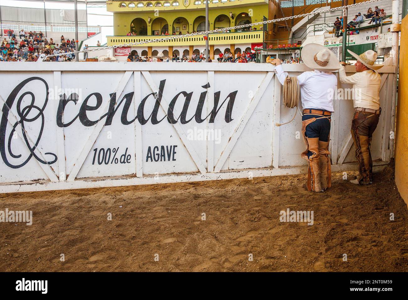 Charros watch a charreada Mexican rodeo at the Lienzo Charro Zermeno ...