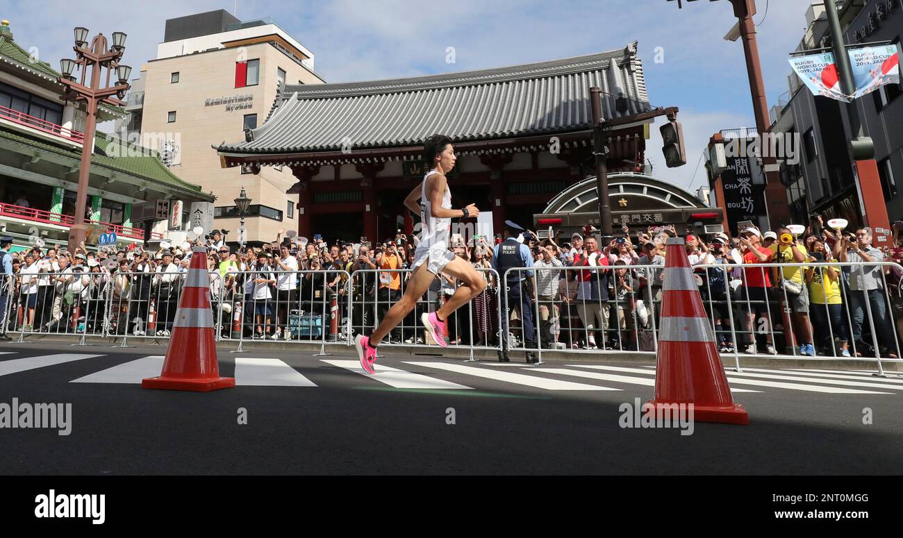 Runners compete during the Marathon Grand Championship in Asakusa ...