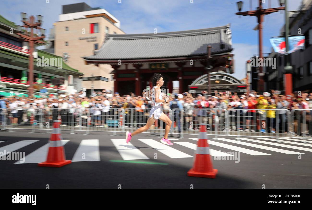 Runners compete during the Marathon Grand Championship in Asakusa ...