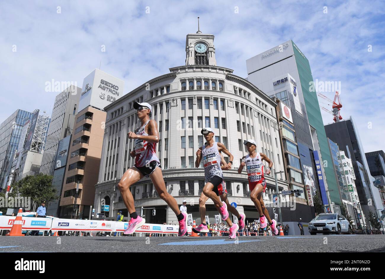 Runners compete during the Marathon Grand Championship in Ginza ...