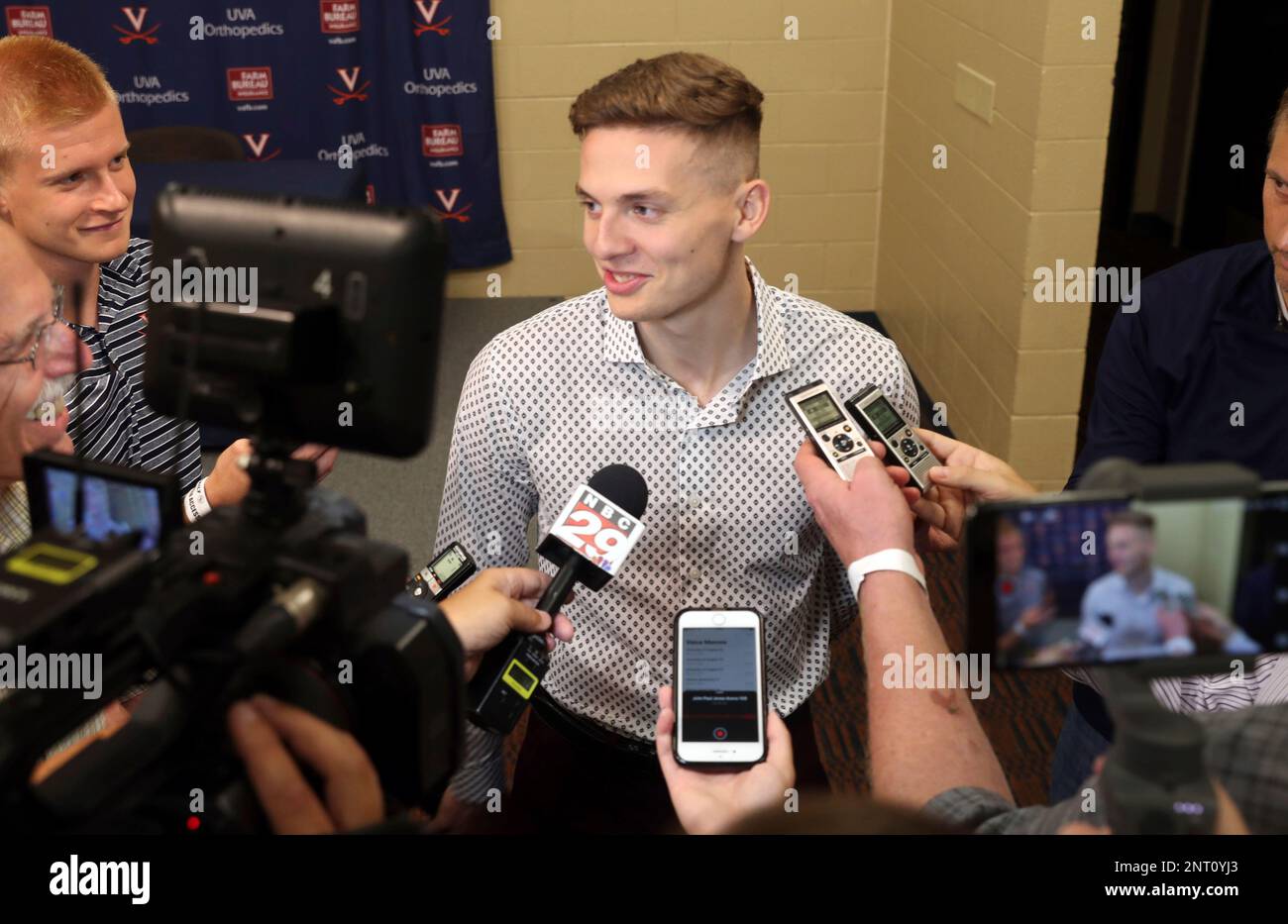 Former Virginia player Kyle Guy speaks with reporters before a ...