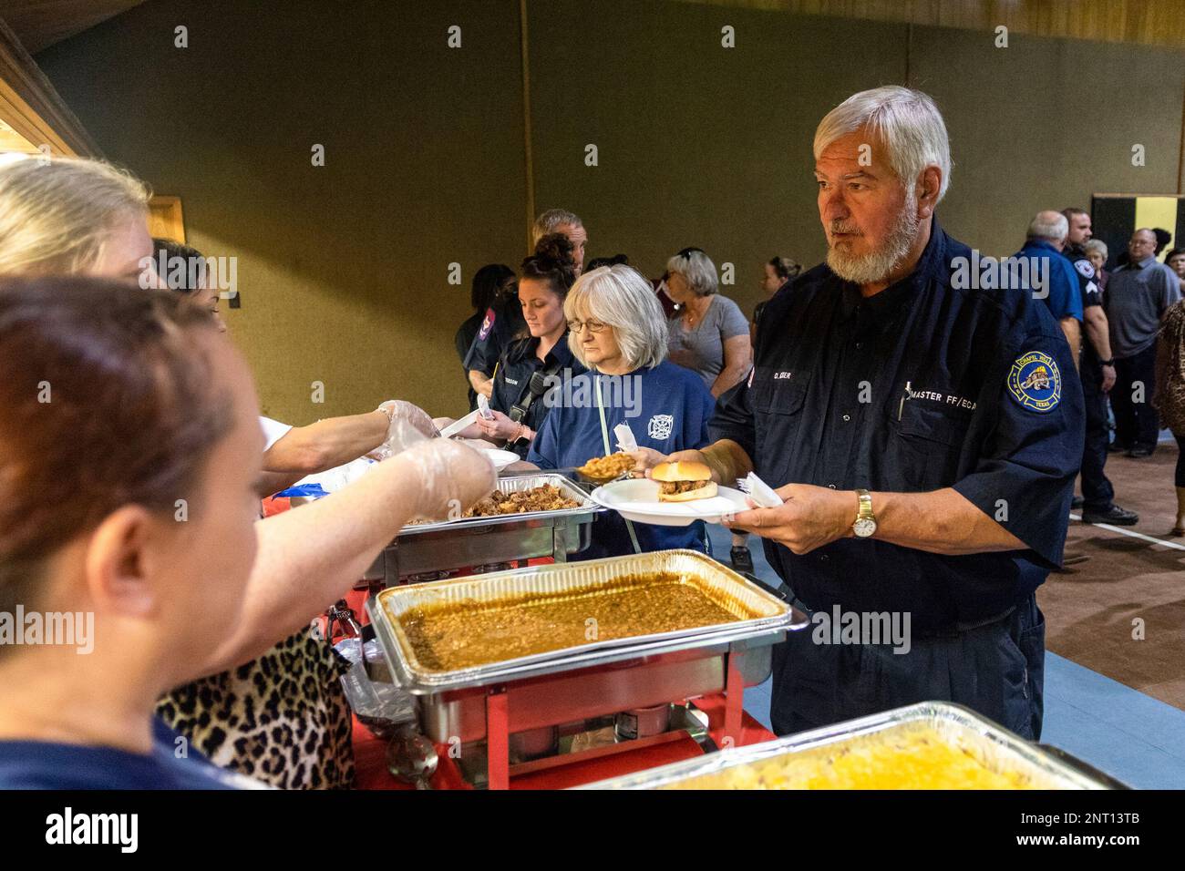 Chapel Hill Firefighter Dale Acker (right) makes his way through the ...