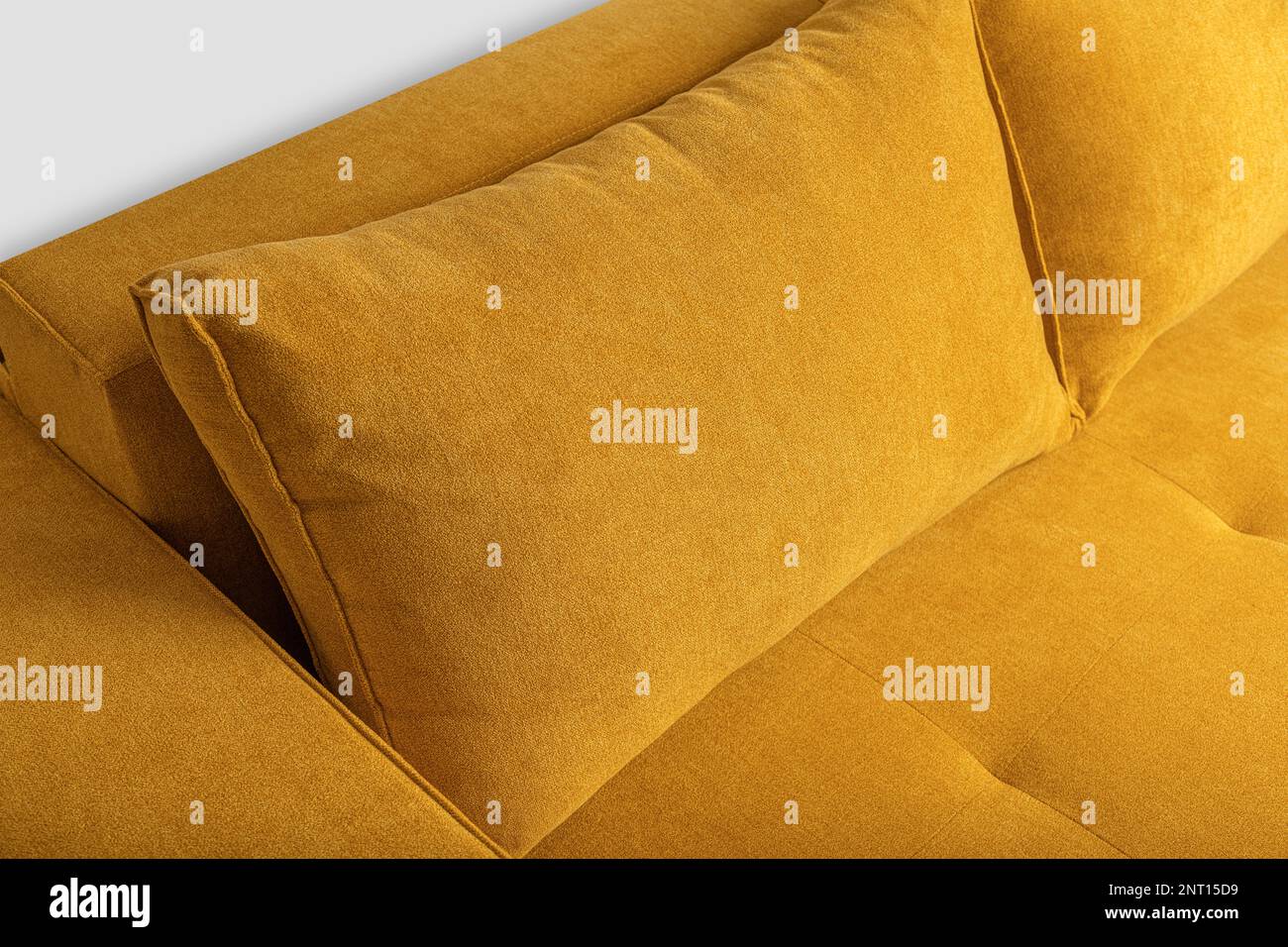 Yellow soft sofa close-up Stock Photo - Alamy