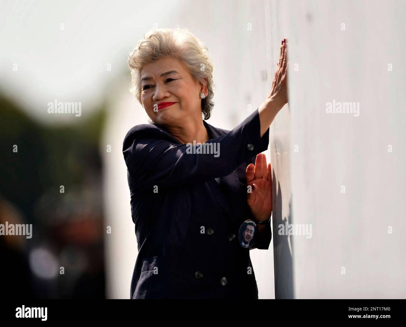 Yachiyo Kuge of Tokyo, Japan, is shown at the Wall of Names at the 18th ...