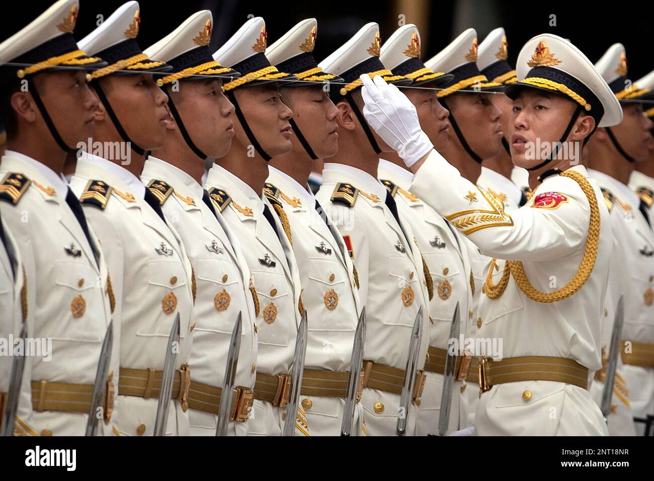 Members of a Chinese honor guard use a string line to check position as ...