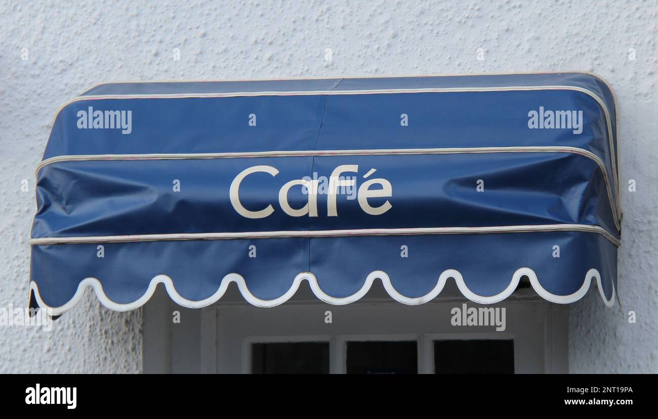 An Awning Sign Over a Cafe Entrance Doorway Stock Photo - Alamy