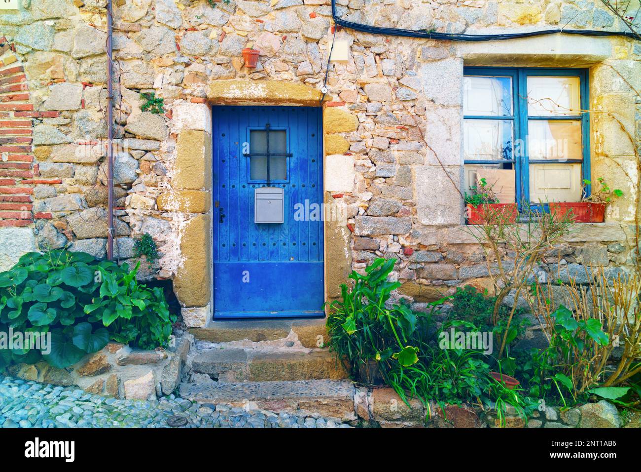 Traditional wooden medieval vintage blue painted doors and window in ...