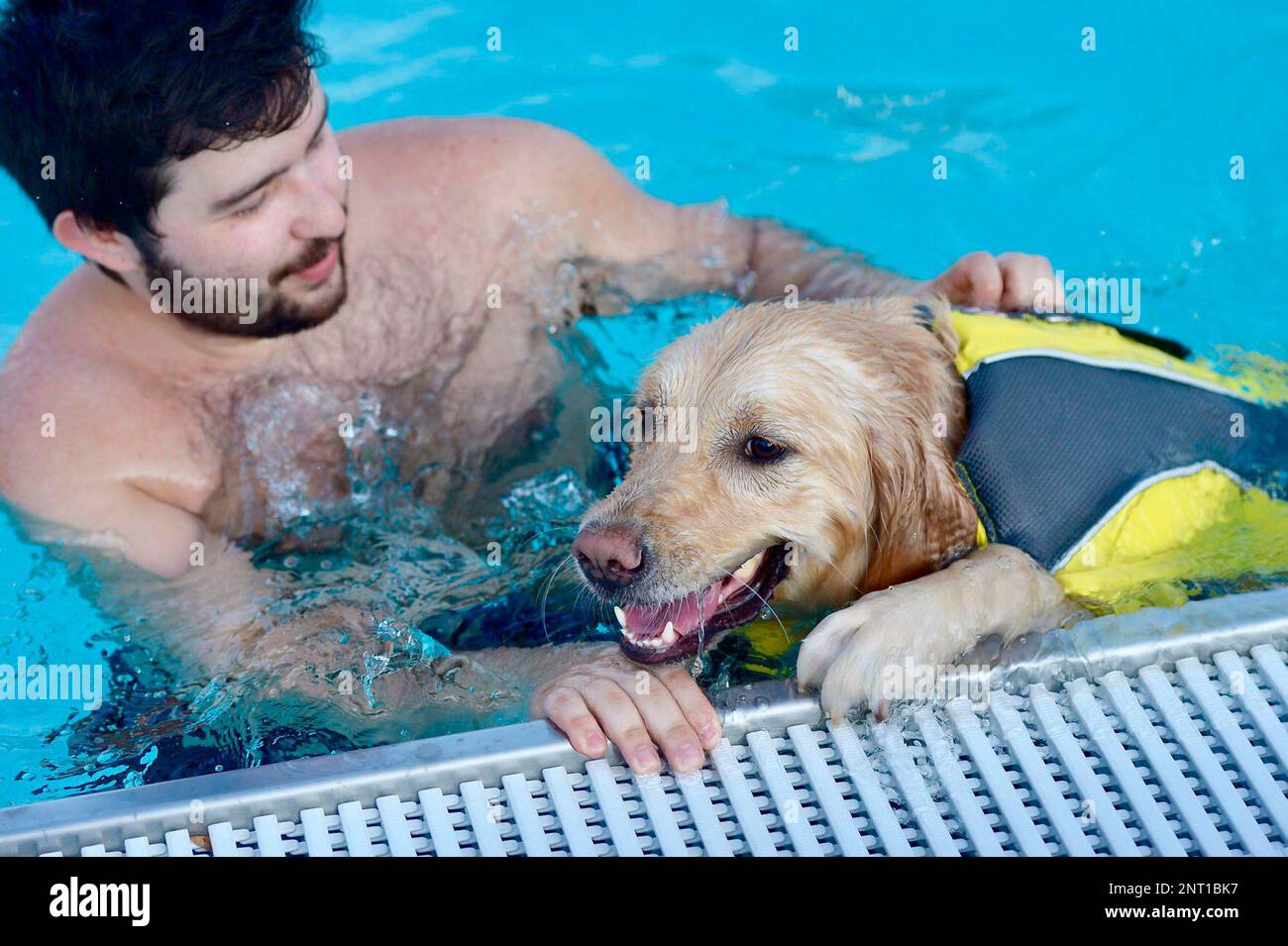 Michael Caprio, of Falling Waters, W.Va., swims with his two-year-old ...