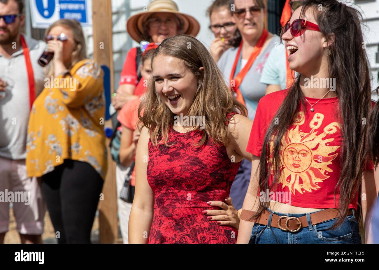 Two women cast members laugh during a promenade performance of Romeo ...