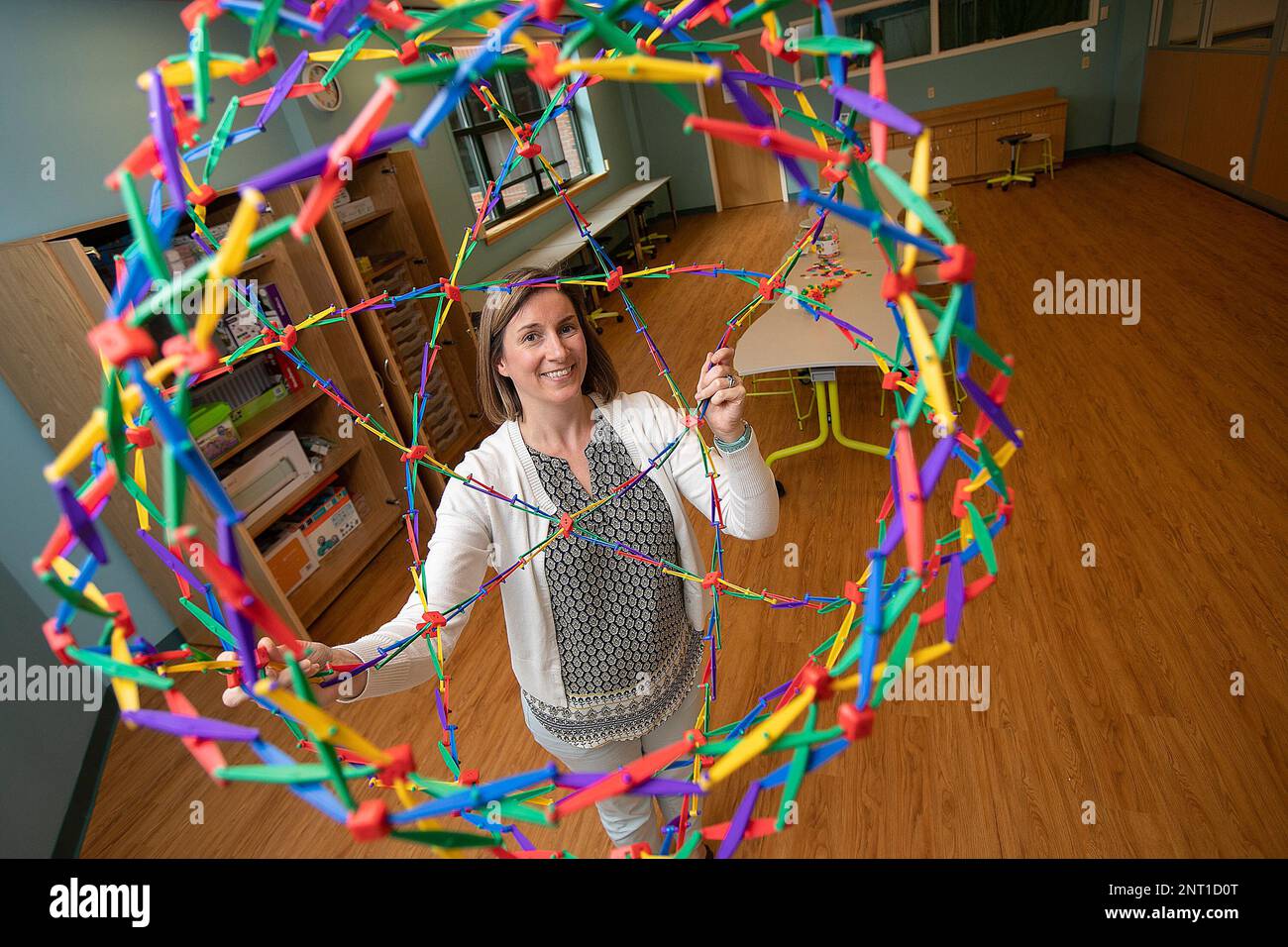 Kari Hamad, head of Children's Services, holds an expandable sphere in ...