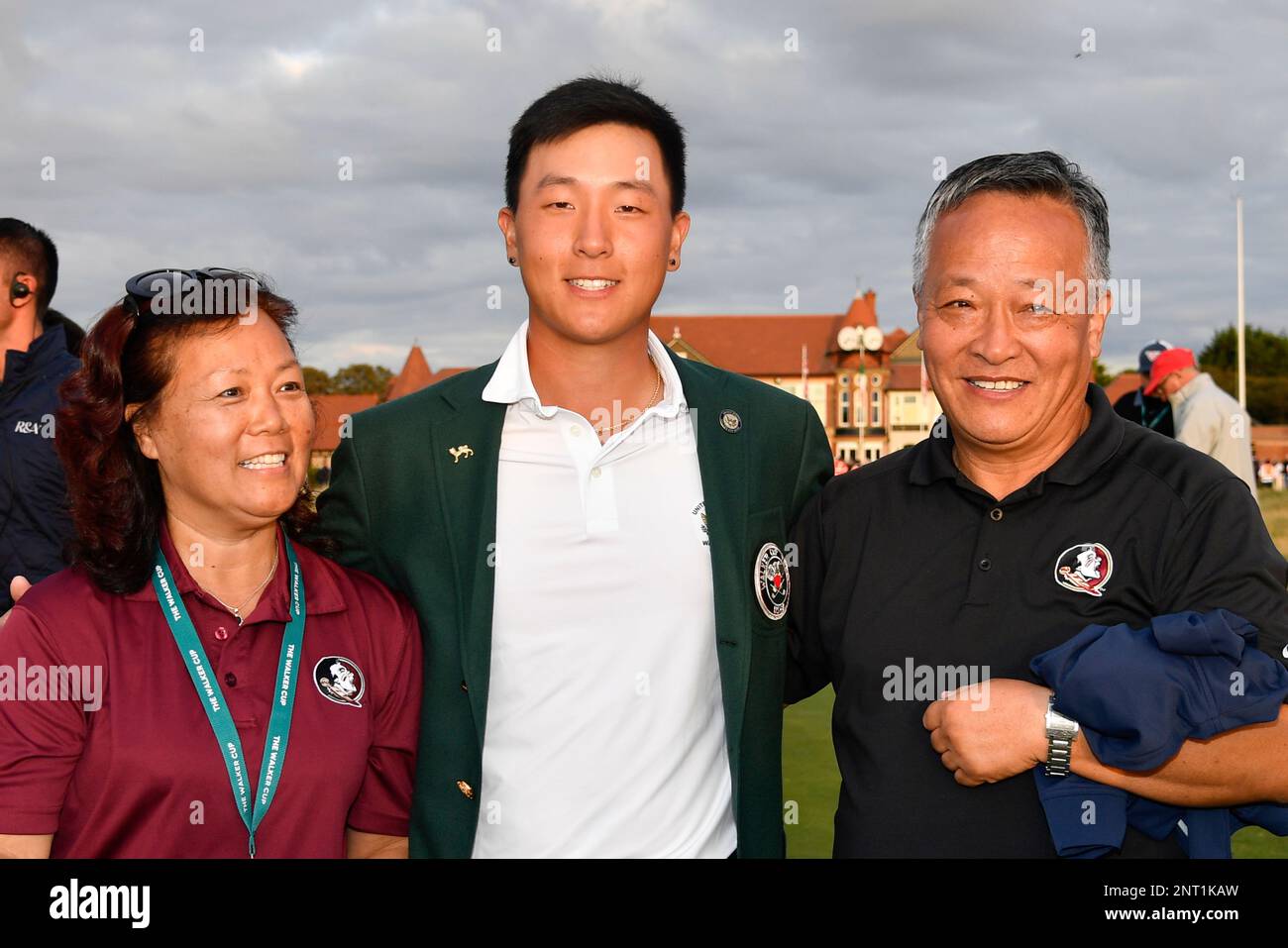 John Pak and his parent pose for a photo after winning the Walker Cup ...