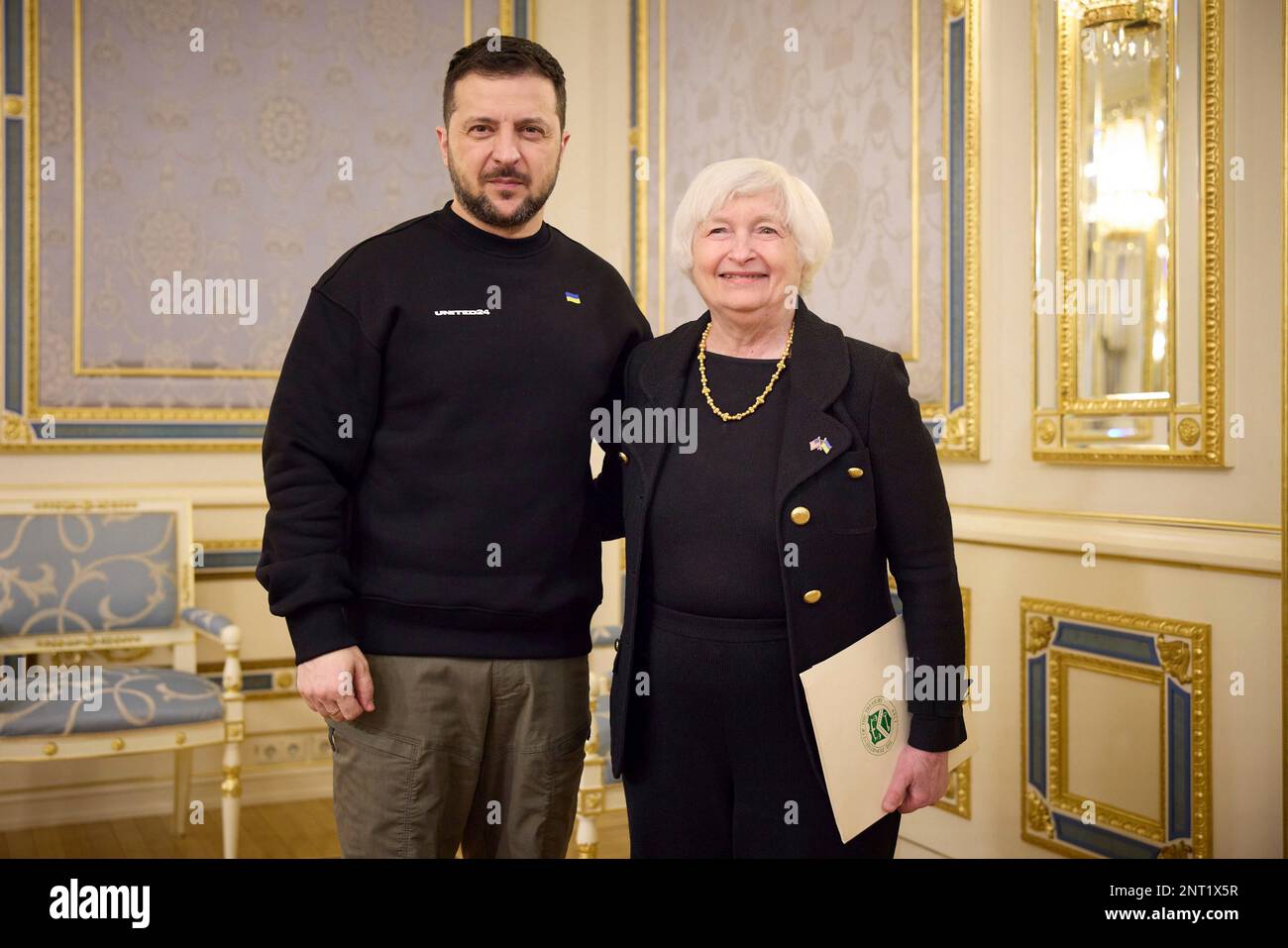 Kyiv, Ukraine. 27th Feb, 2023. Ukrainian President Volodymyr Zelenskyy, left, poses with U.S ...