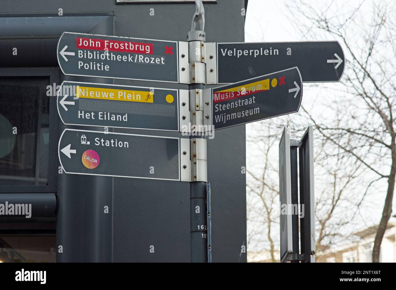 Pole with a blue signpost in the center of Arnhem in the Netherlands ...