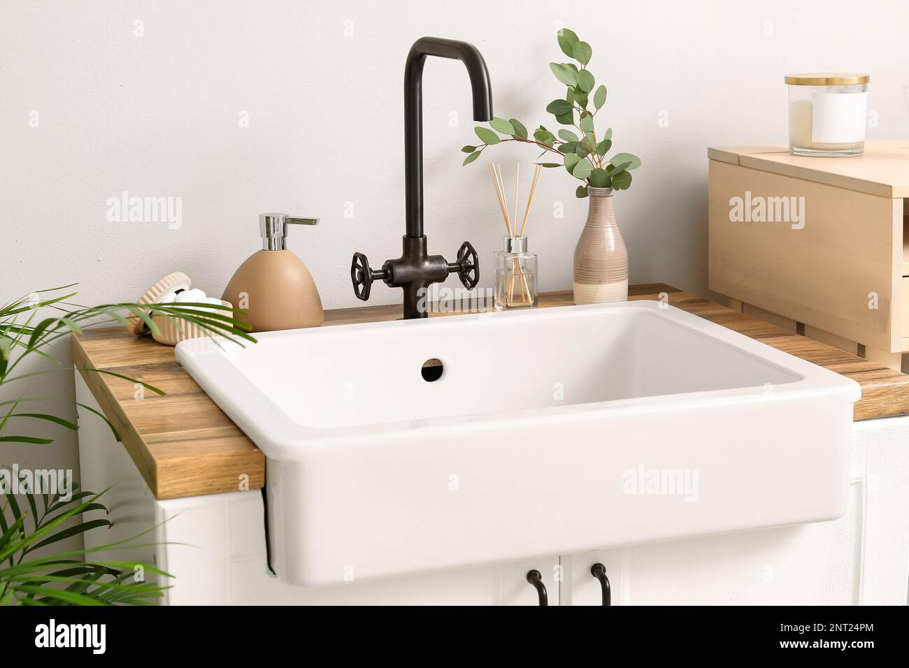 Ceramic sink with bath accessories, reed diffuser and eucalyptus in ...