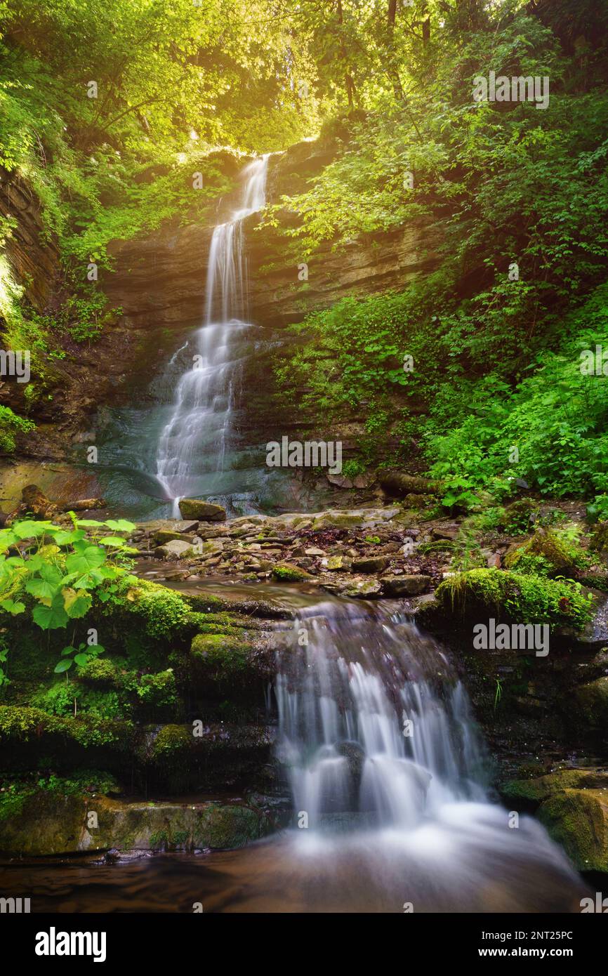 Vibrant calm landscape background. Beautiful stream waterfall in ...