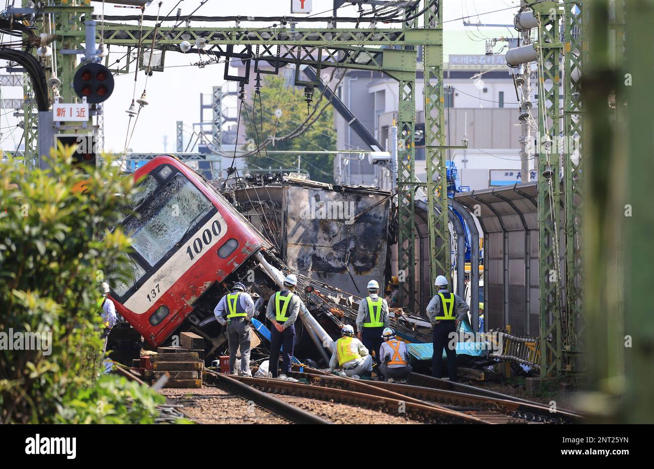 A photo shows a train of Keikyu Line derailed between Kanagawa ...