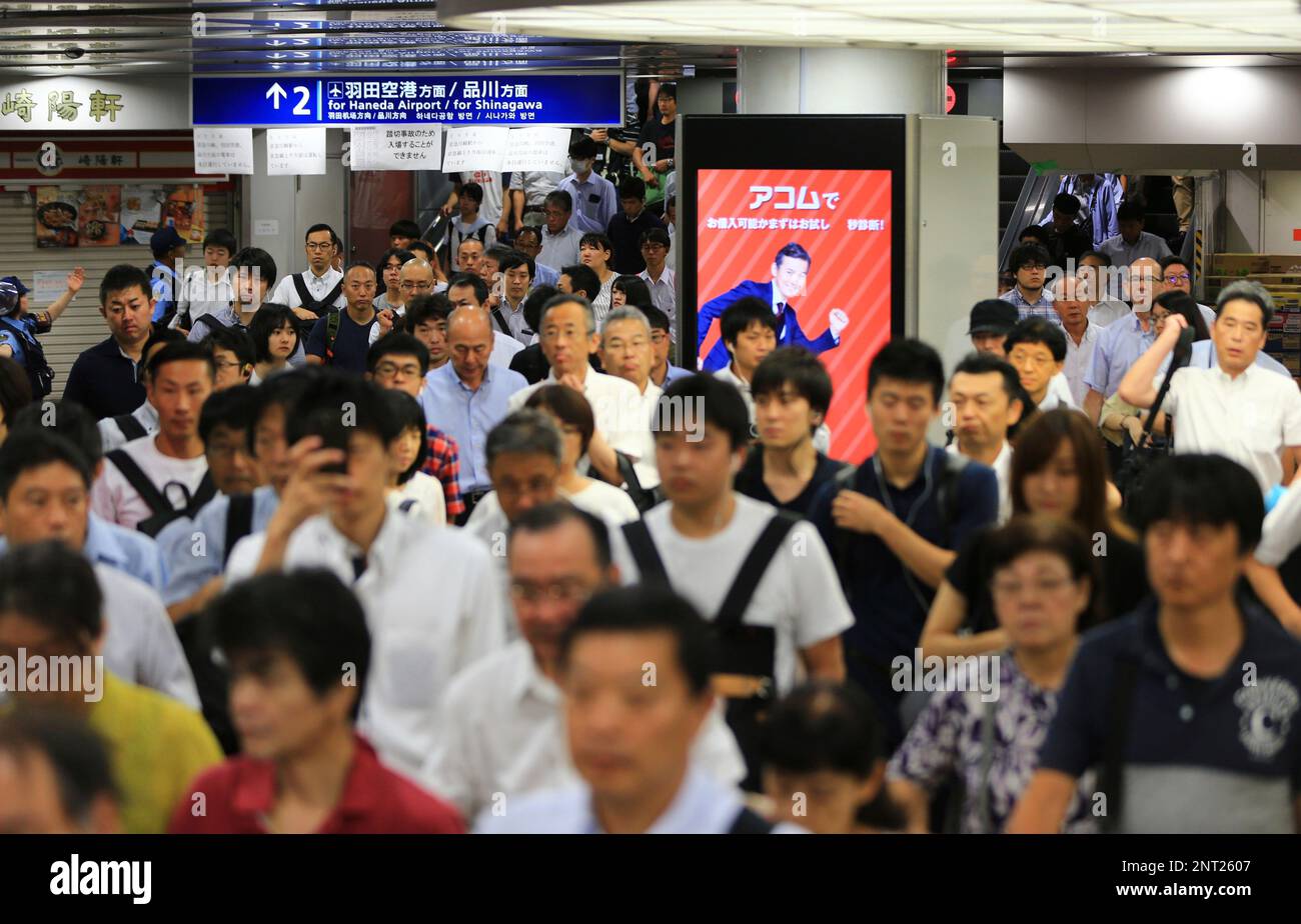 Yokohama Station is crowded with passengers, mostly on their way to ...