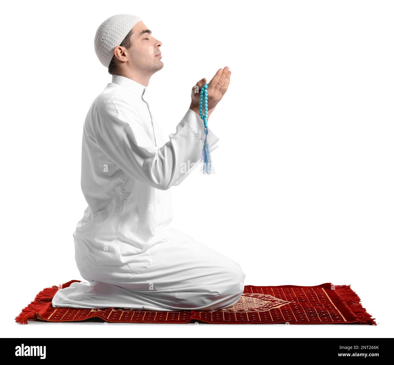 Praying Muslim man on white background Stock Photo - Alamy