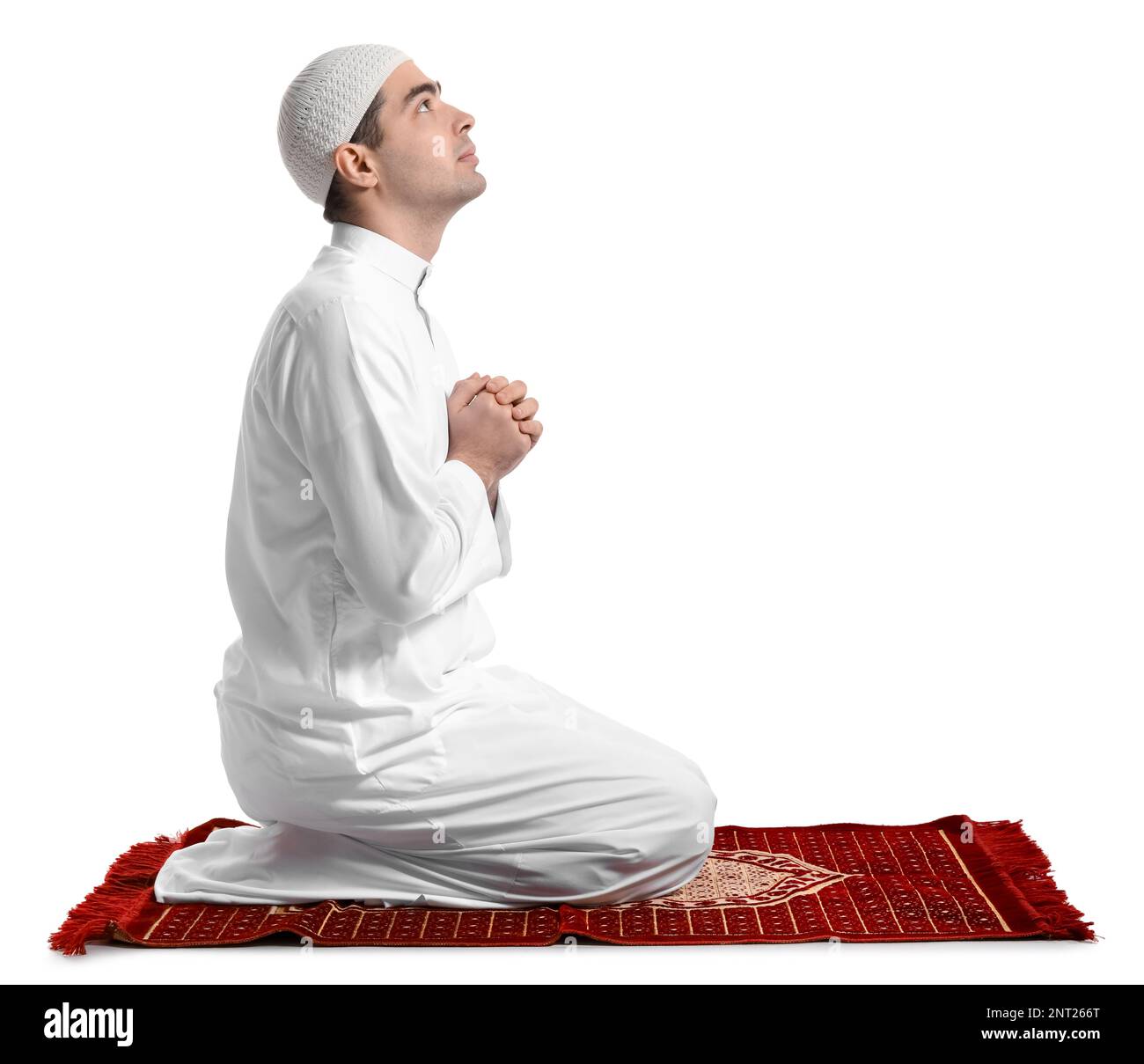 Praying Muslim man on white background Stock Photo - Alamy