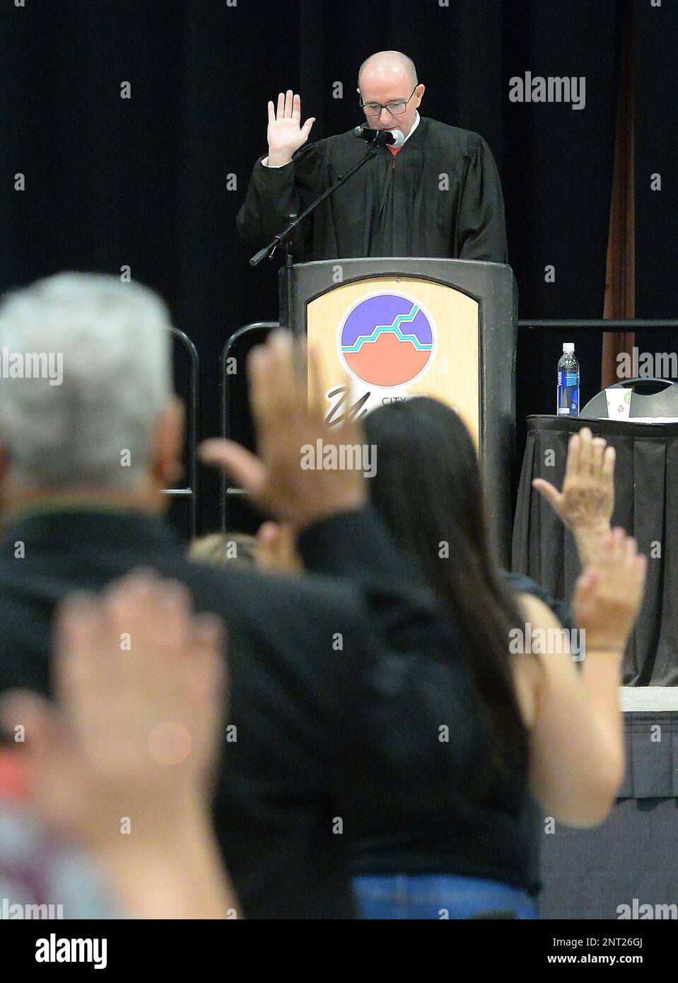 U.S. Magistrate Judge James Metcalf (top) administers the official ...