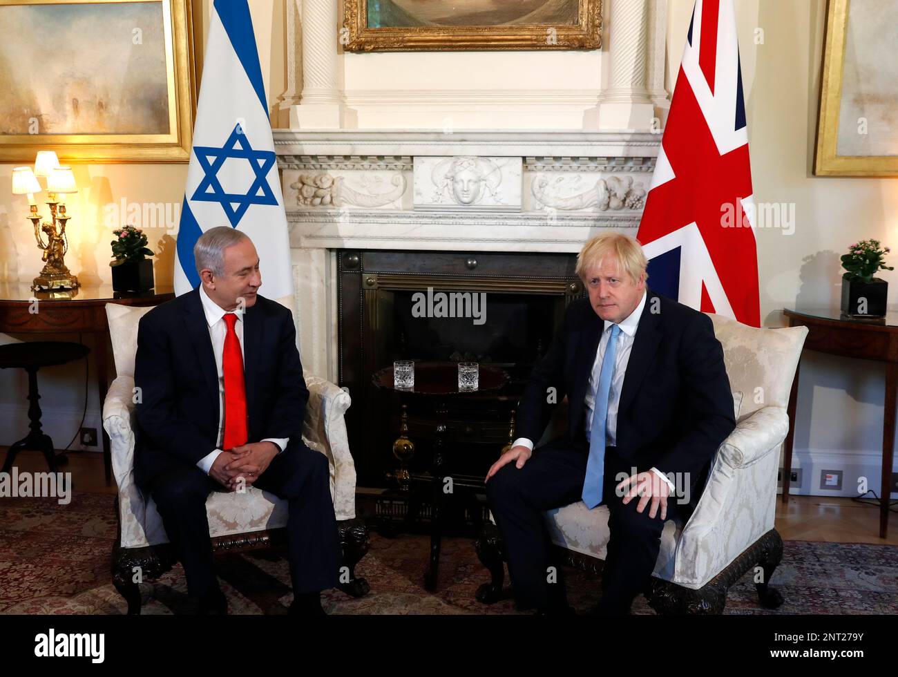 British Prime Minister Boris Johnson, right, poses for photographers ...