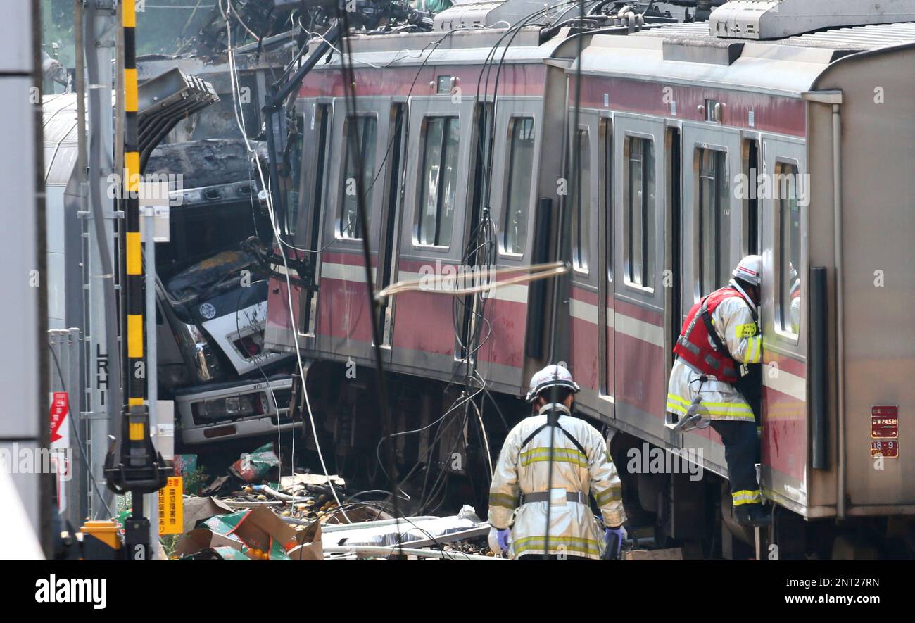 A photo shows a train of Keikyu Line derailed after a truck collided in ...