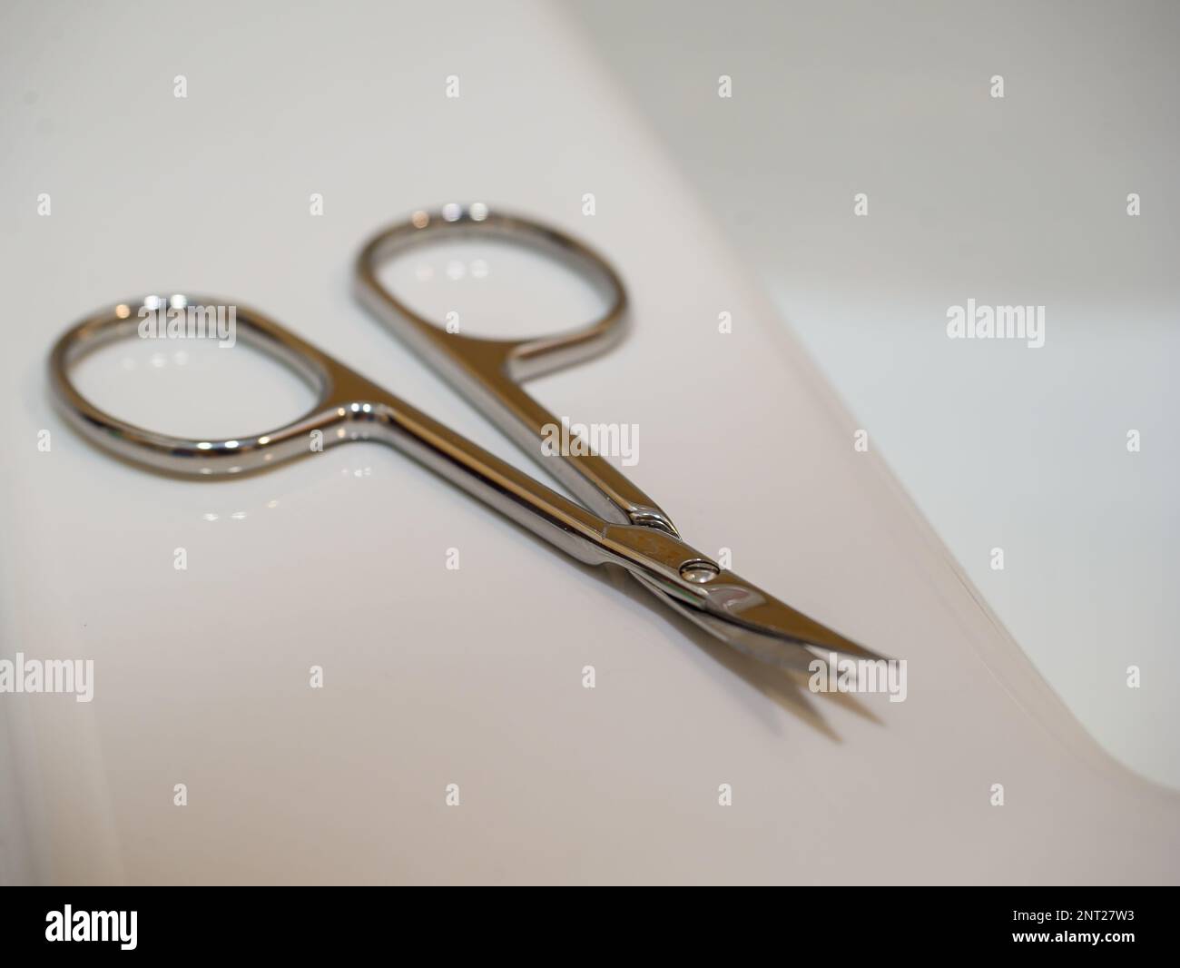 Manicure scissors for nails on a white background Stock Photo - Alamy