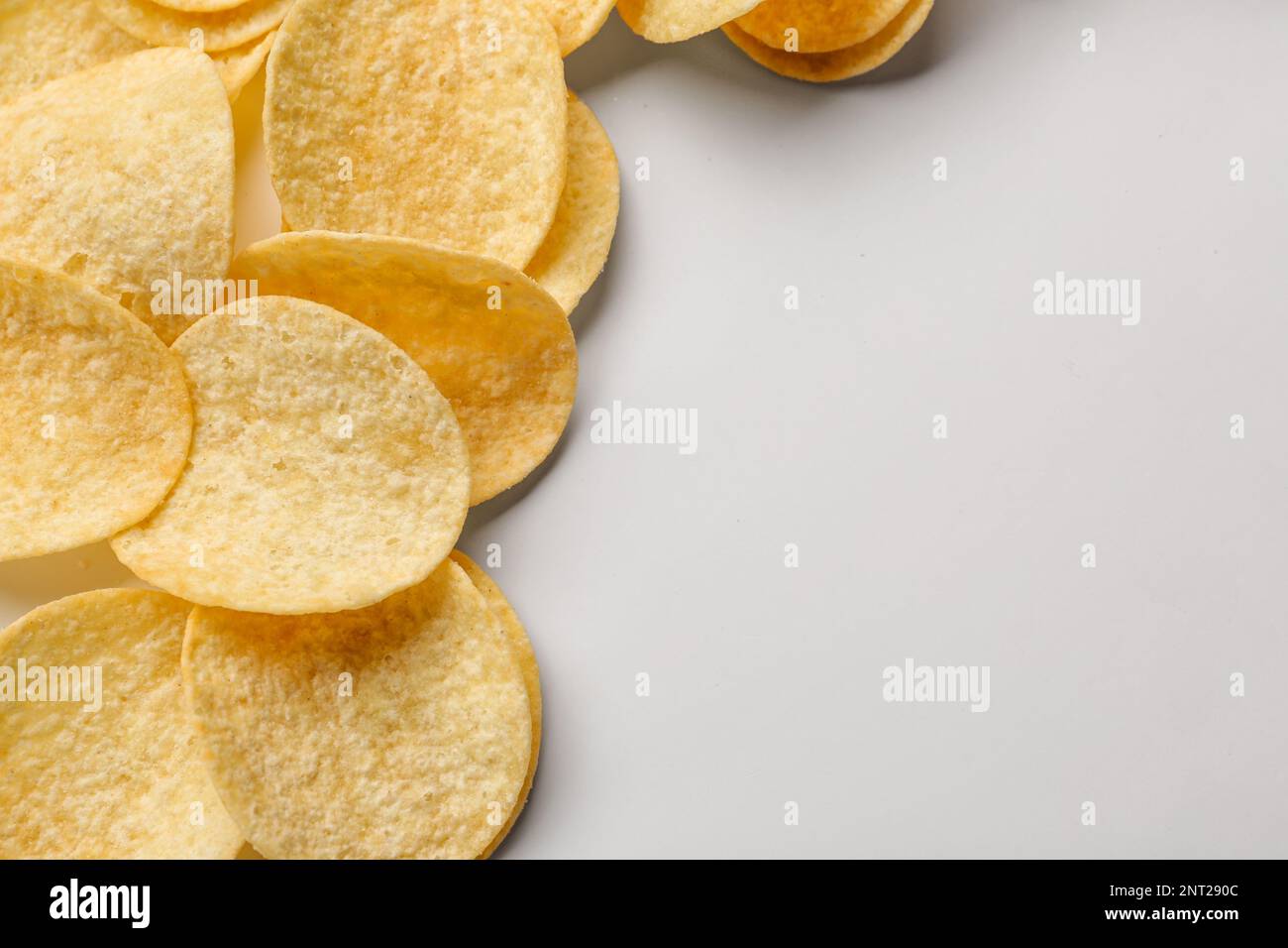 Frame made of delicious potato chips on white background Stock Photo ...