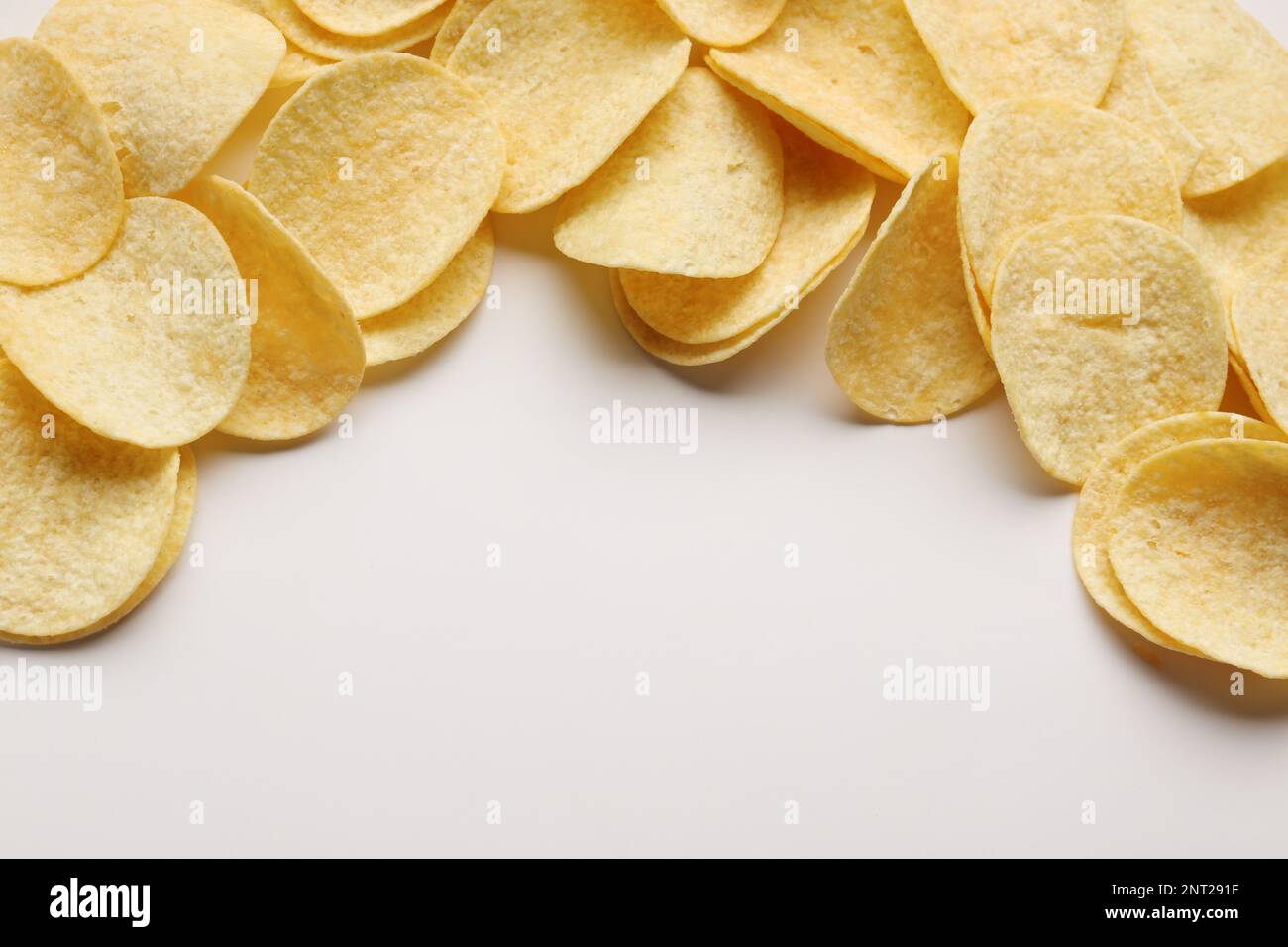 Frame made of delicious potato chips on white background Stock Photo ...
