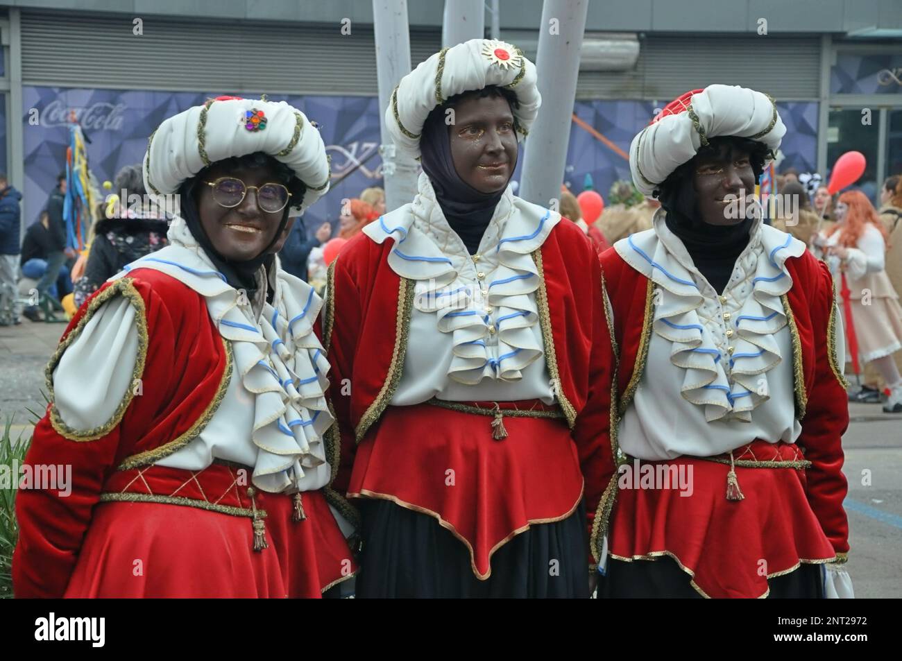 Three beautiful girls pose on carnival day in the carnival parade ...