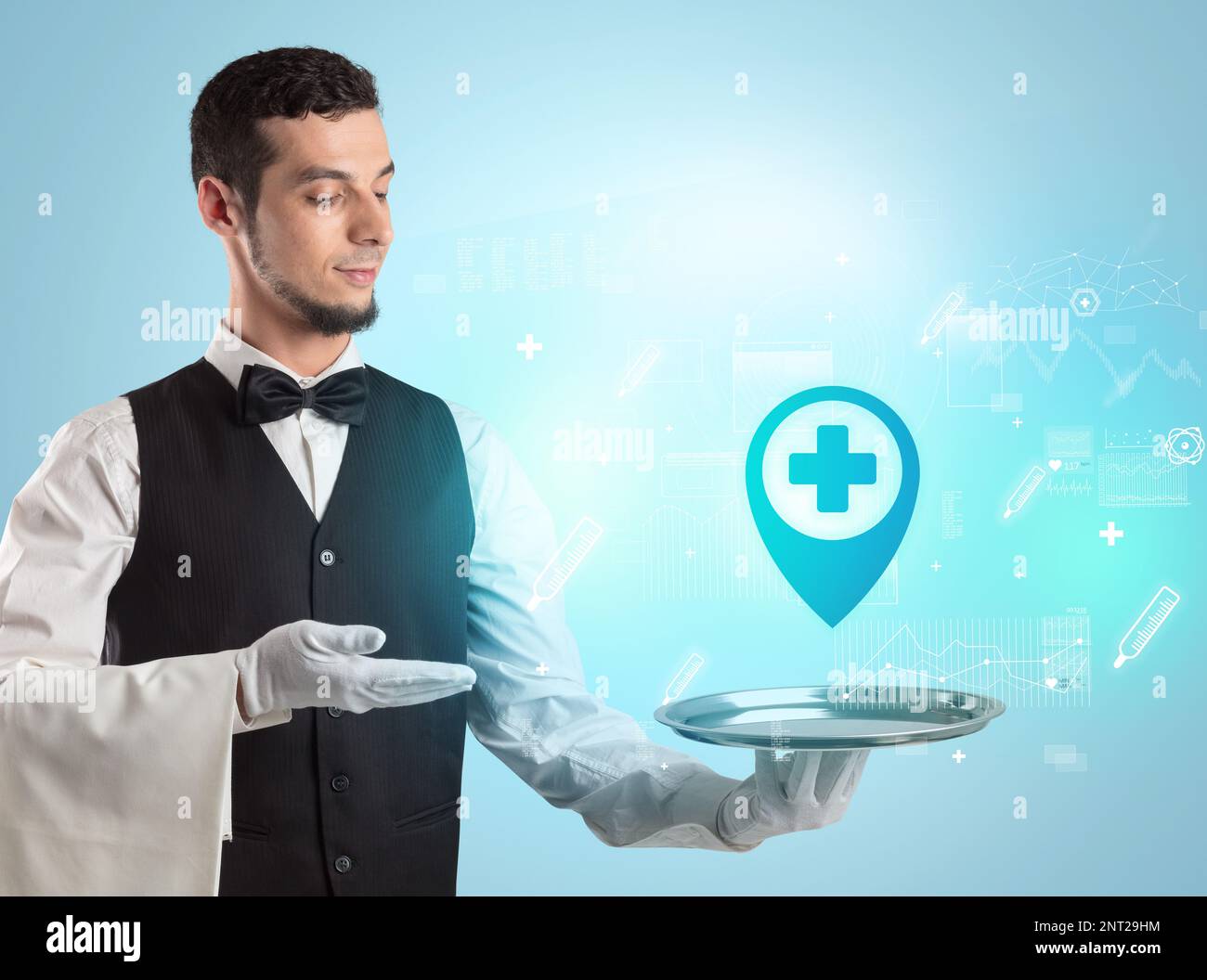 Handsome young waiter in tuxedo holding healthcare icons on tray Stock ...