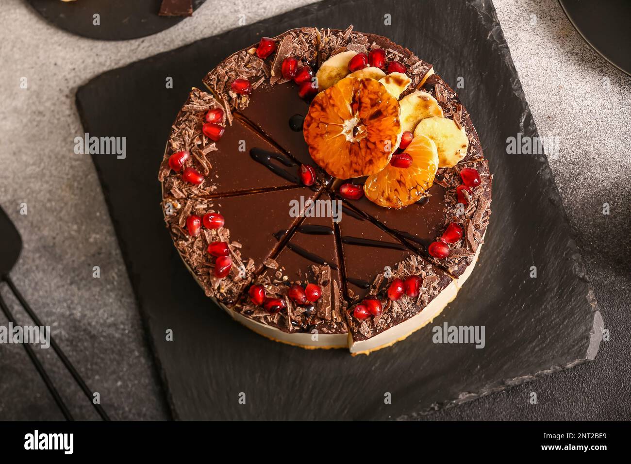 Slate board with delicious birds milk cake on black and white ...
