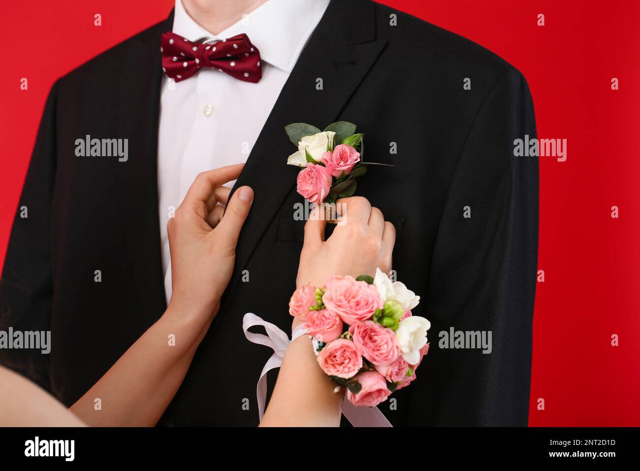 Pinning corsage hi-res stock photography and images - Alamy
