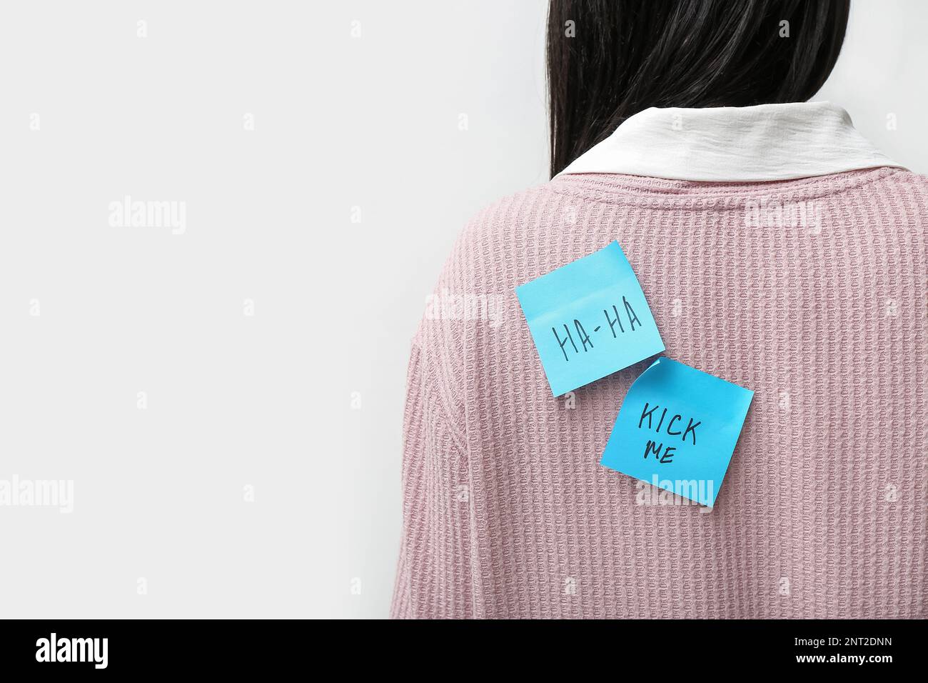 Sticky papers on woman's back against white background, closeup. April ...