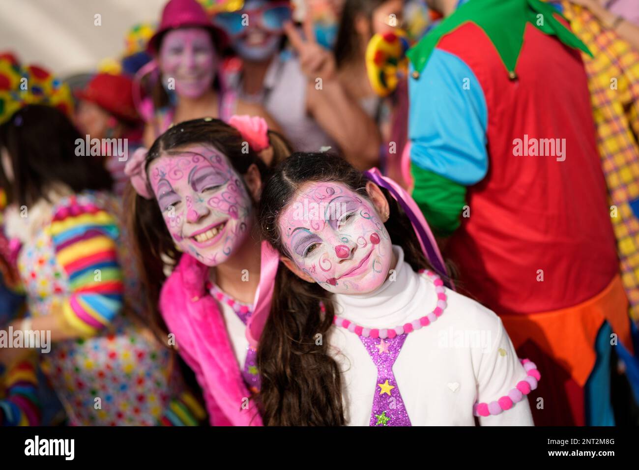 A child poses for the camera during the Clowns Parade in Sesimbra ...