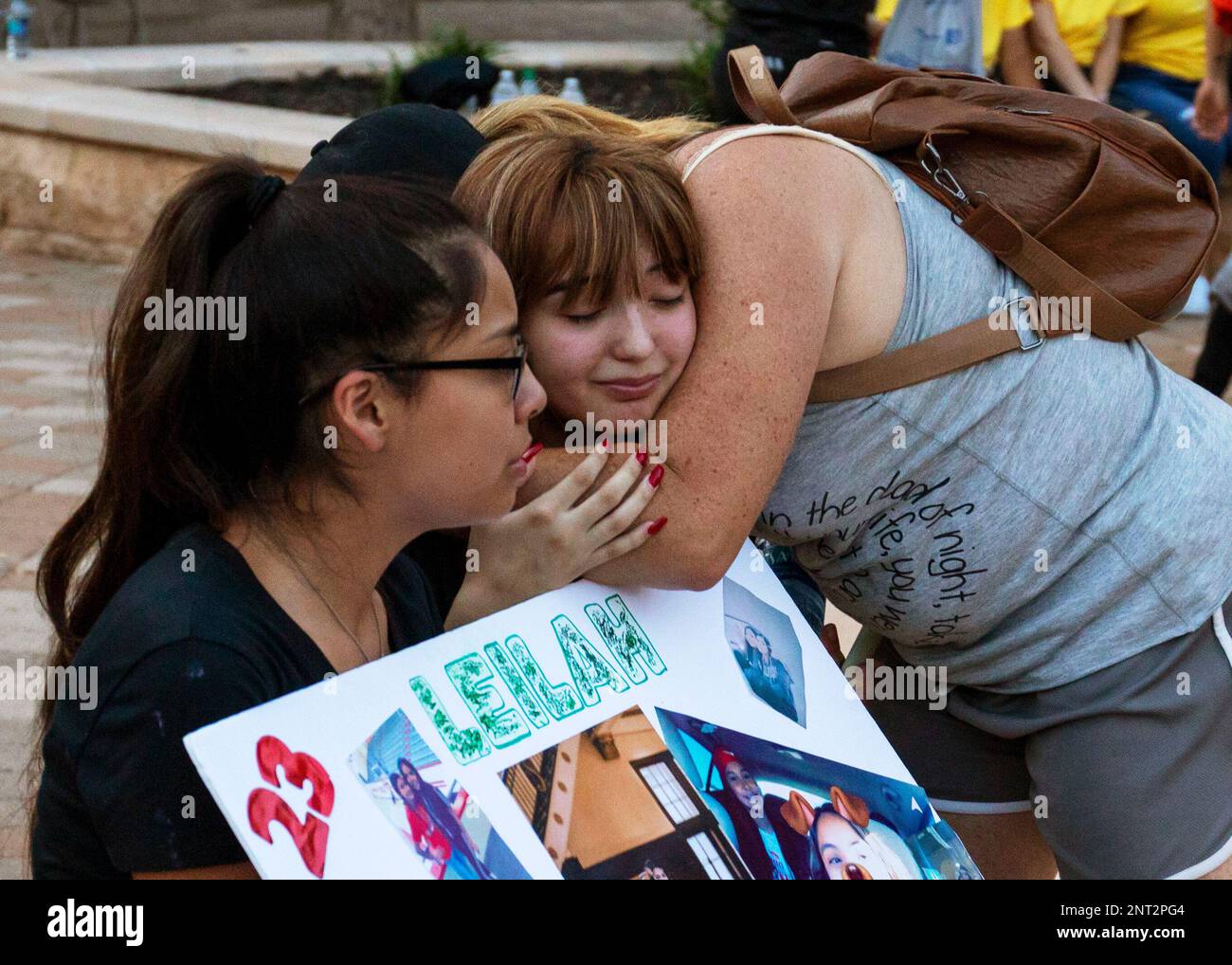 Yasmin Natera and Celeste Lujan are embraced after a vigil for victims ...