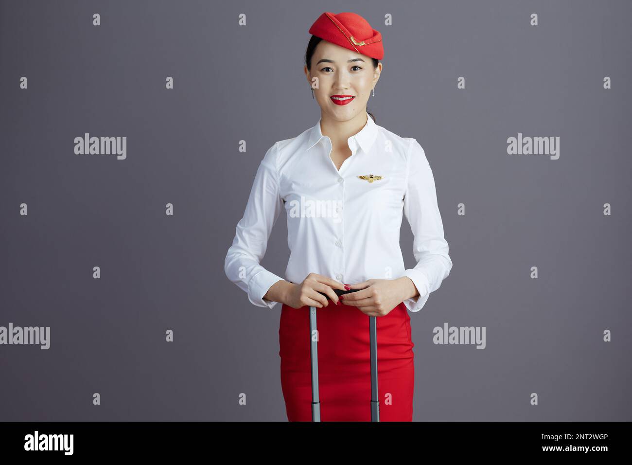 happy modern air hostess asian woman in red skirt and hat uniform with ...