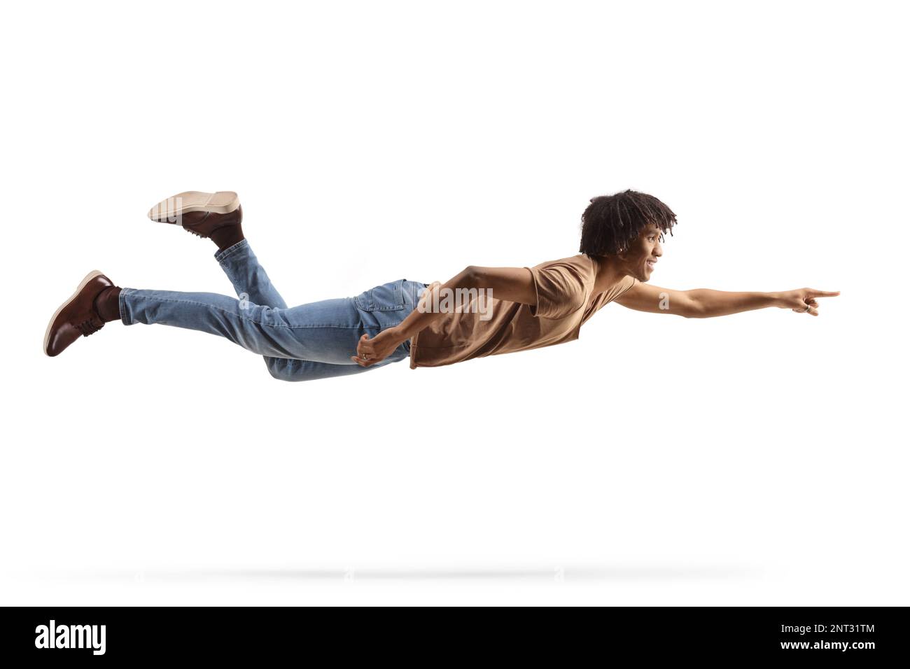 Full length shot of an african american man flying and pointing ...