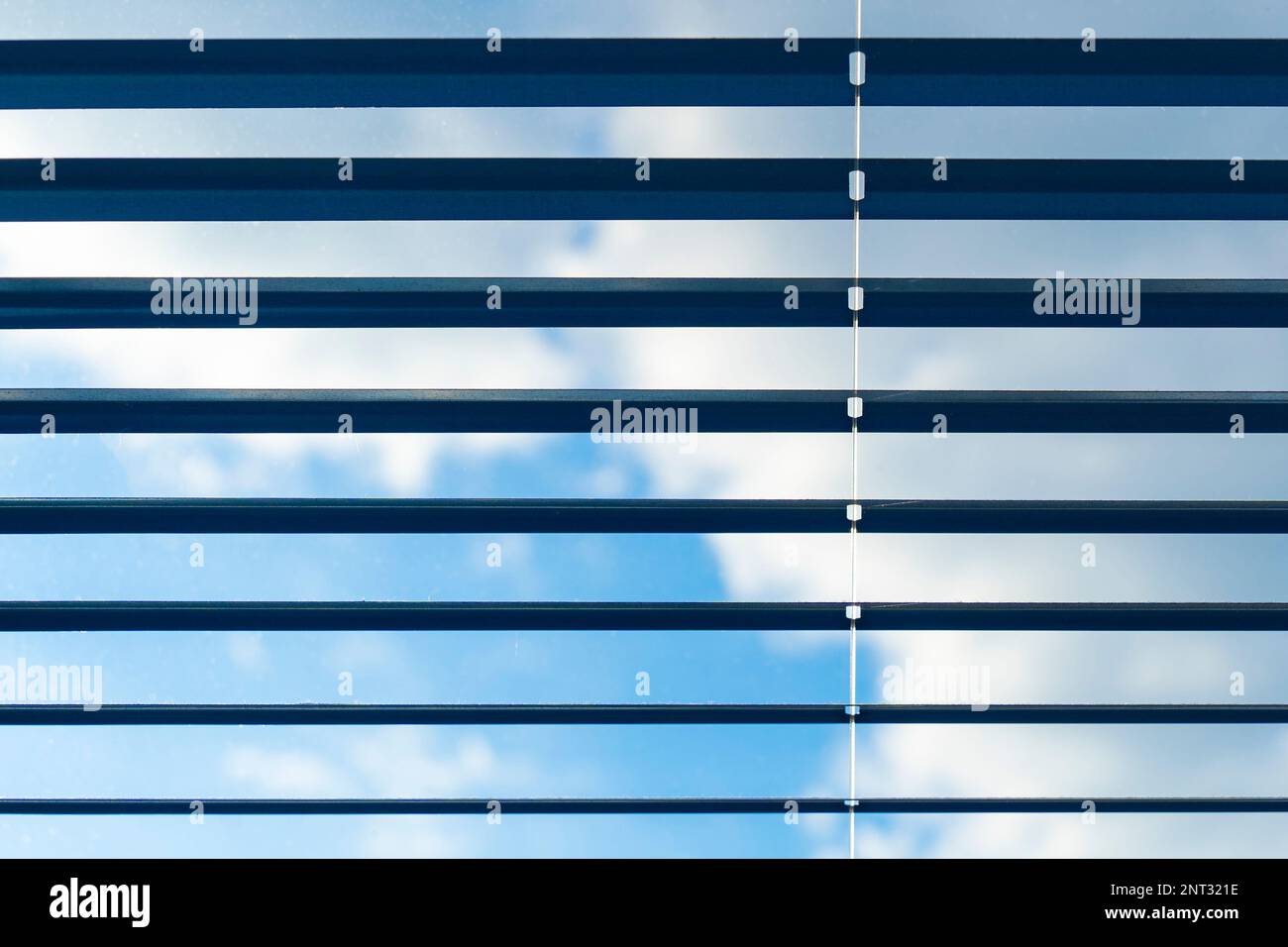 Window blinds in front of the blue sky Stock Photo - Alamy