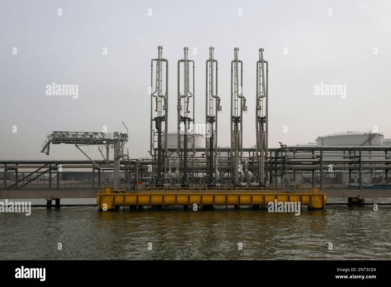 Mechanical loading and discharging arms in oil terminal Stock Photo - Alamy