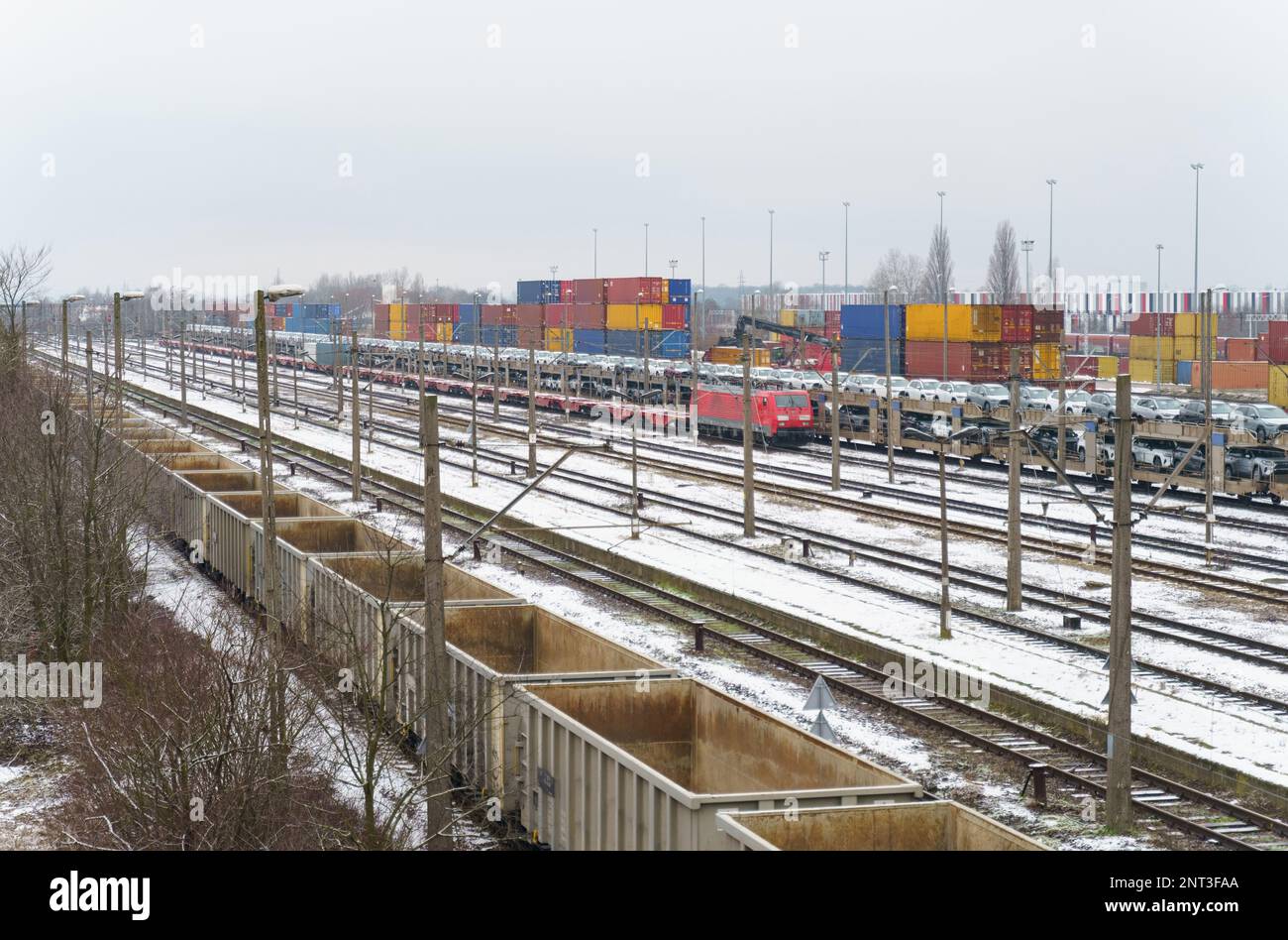 Freight unloading and loading railway station. On the platform there ...