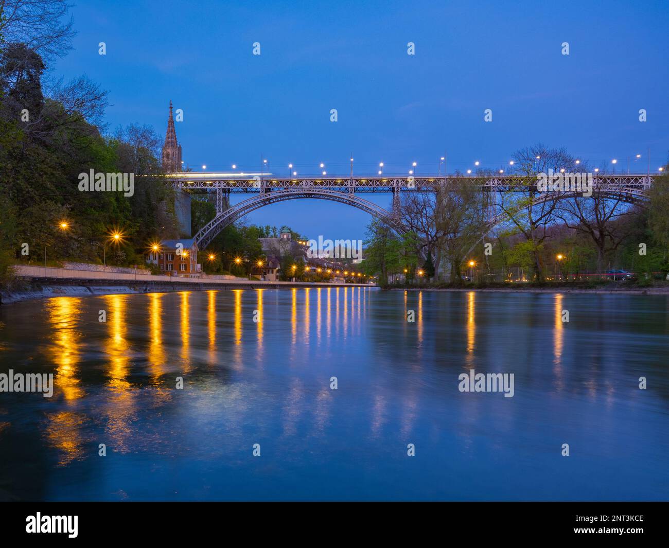 Berne, Switzerland - April 15th 2022: Illuminated bridge over the Aare ...