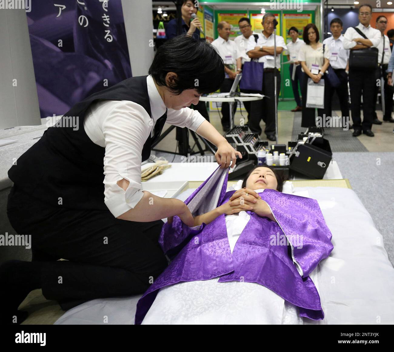 A woman performs the death ritual during the Ending Industrial ...
