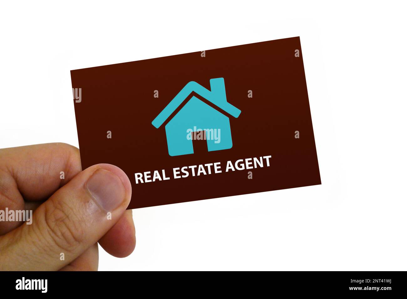 Close-up on the fingers of a man holding a real estate agent card Stock ...