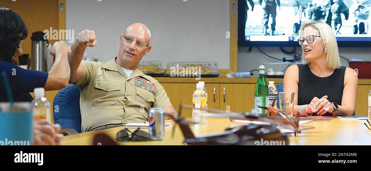 U.S. Marine Corps Col. David Suggs (second from left), commander of ...