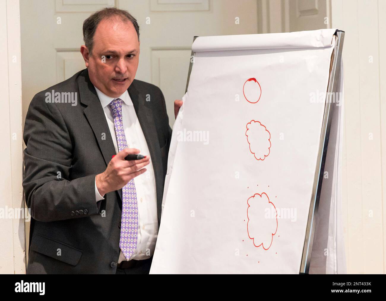 Dr. Jonathan Eisenstat, a forensic pathology consultant, sketches the ...