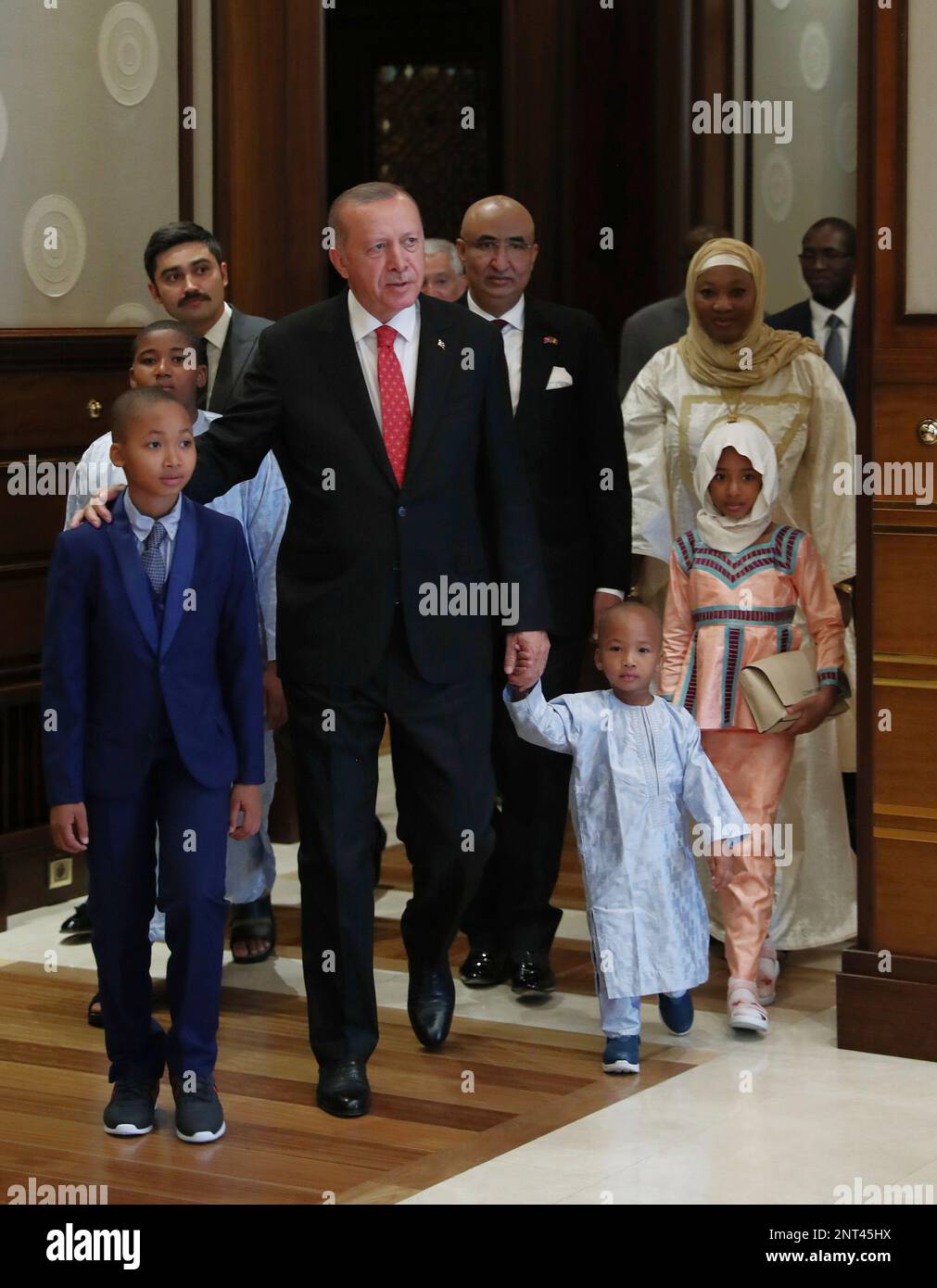 Turkey's President Recep Tayyip Erdogan holds by hand Amadou Ag Mohamed ...