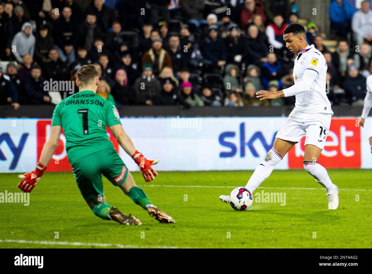 Swansea, UK. 27th Feb, 2023. Morgan Whittaker of Swansea City shoots ...